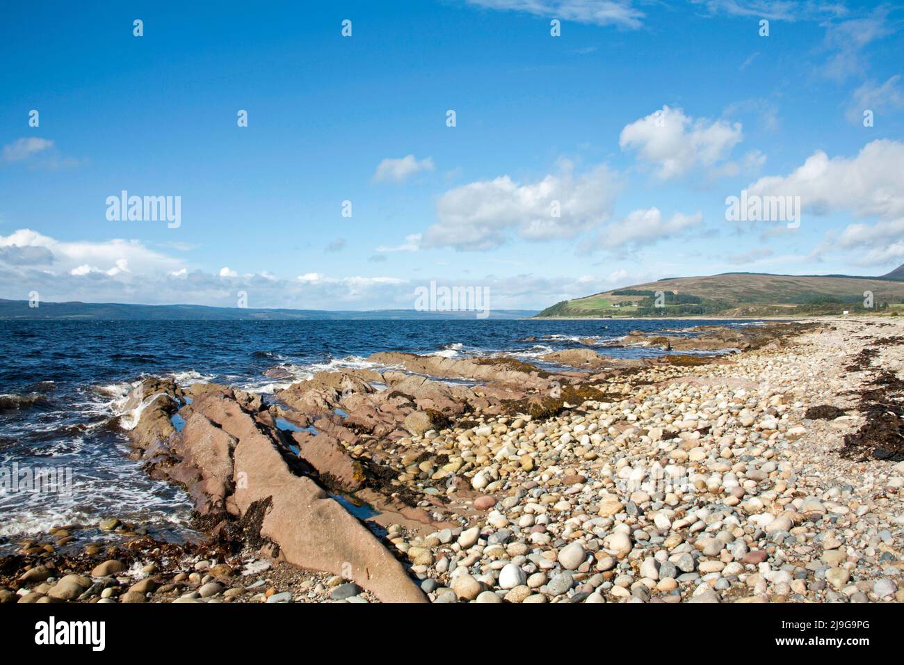 Pebble beach and small rock outcrops Machrie Bay looking out to ...