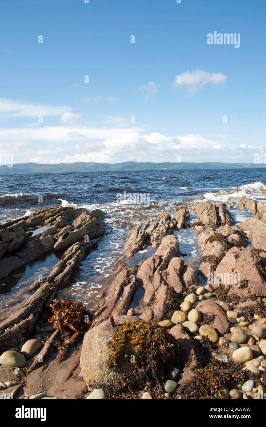 Pebble beach and small rock outcrops Machrie Bay looking out to ...