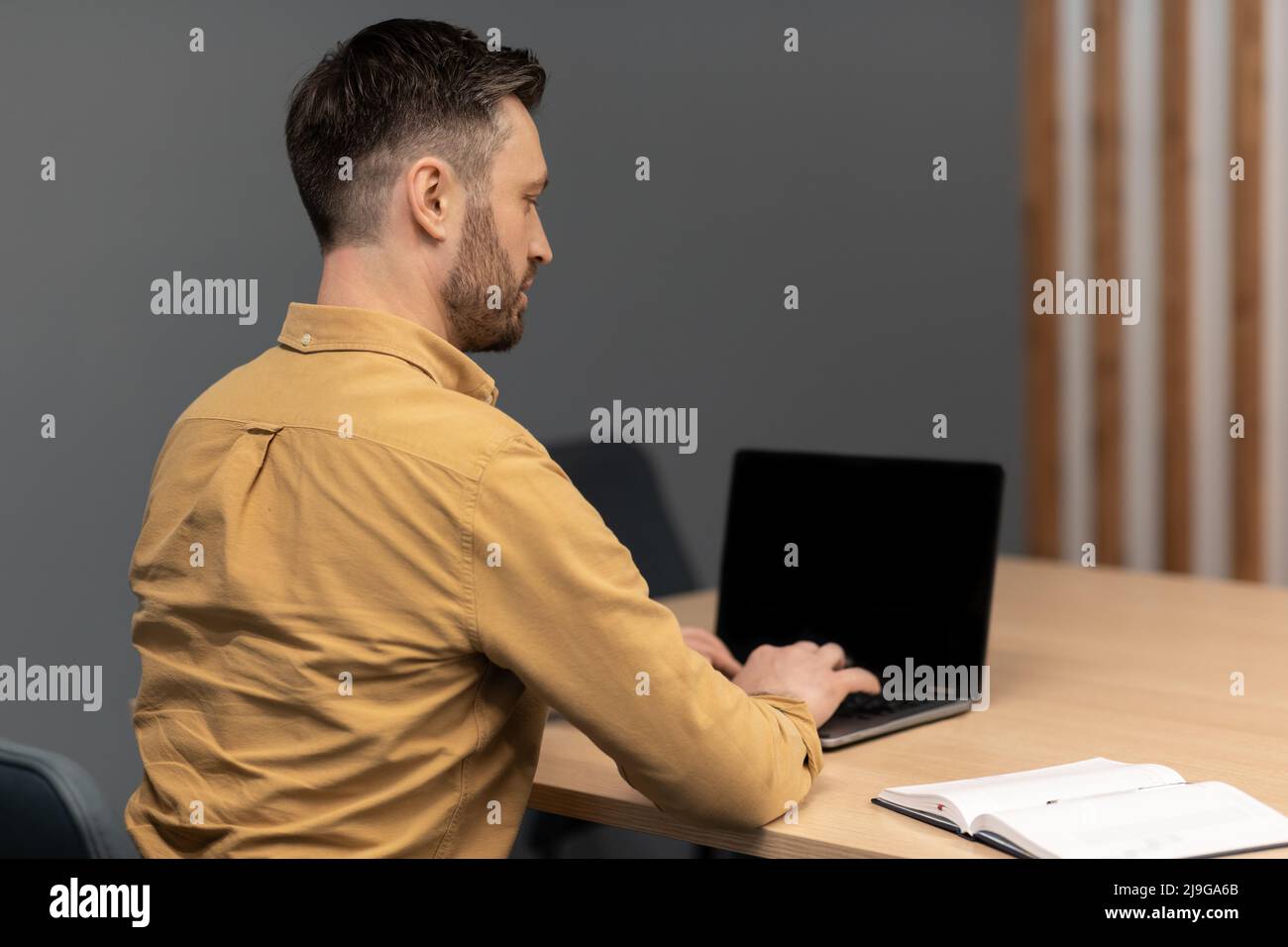 Back View Of Businessman Working Using Laptop Computer In Office Stock ...
