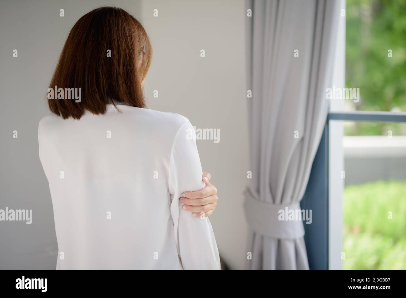 Woman muscle arm, back view hi-res stock photography and images - Alamy
