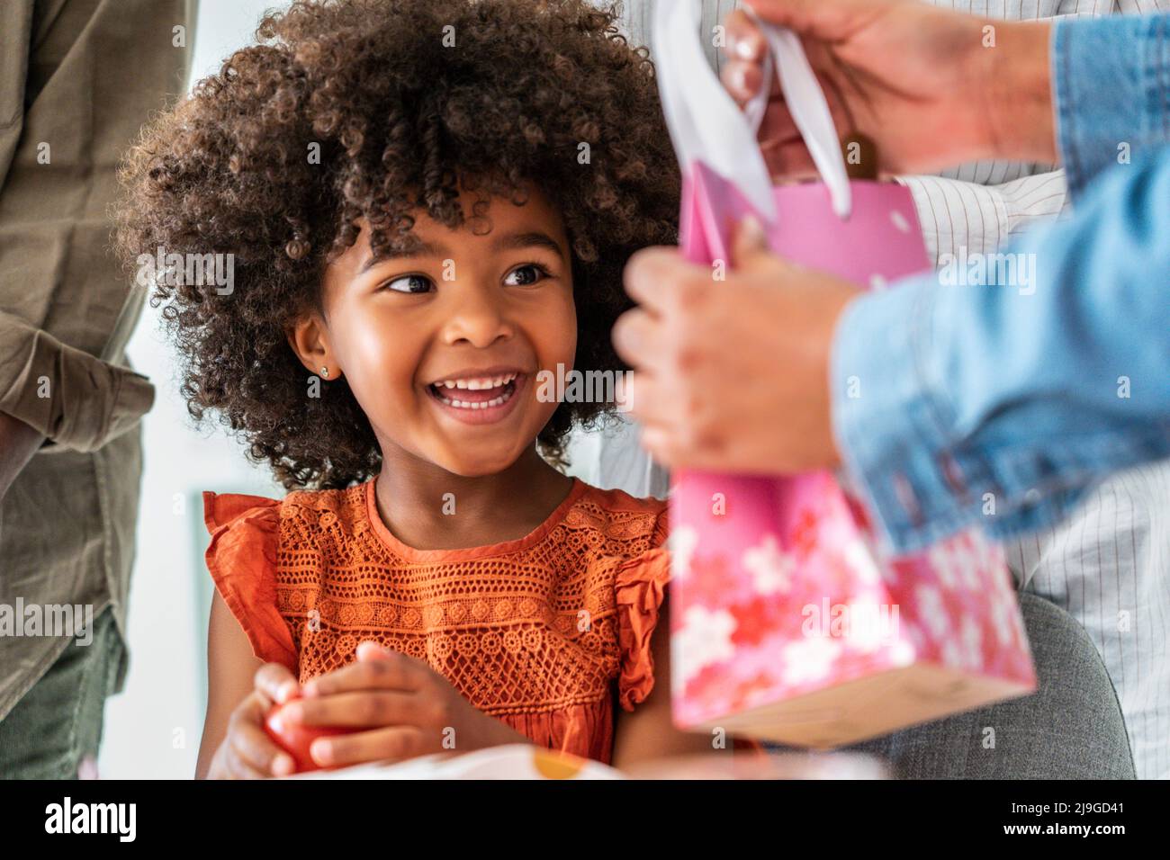 Mother giving birthday gift to her daughter Stock Photo - Alamy