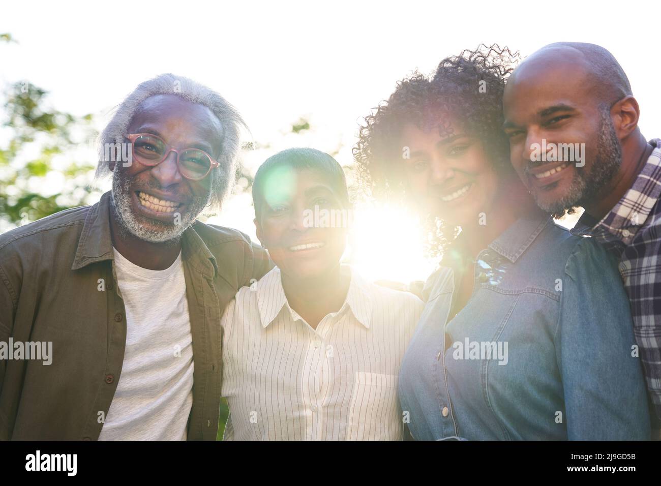 Happy multi-generation family standing in balcony Stock Photo - Alamy