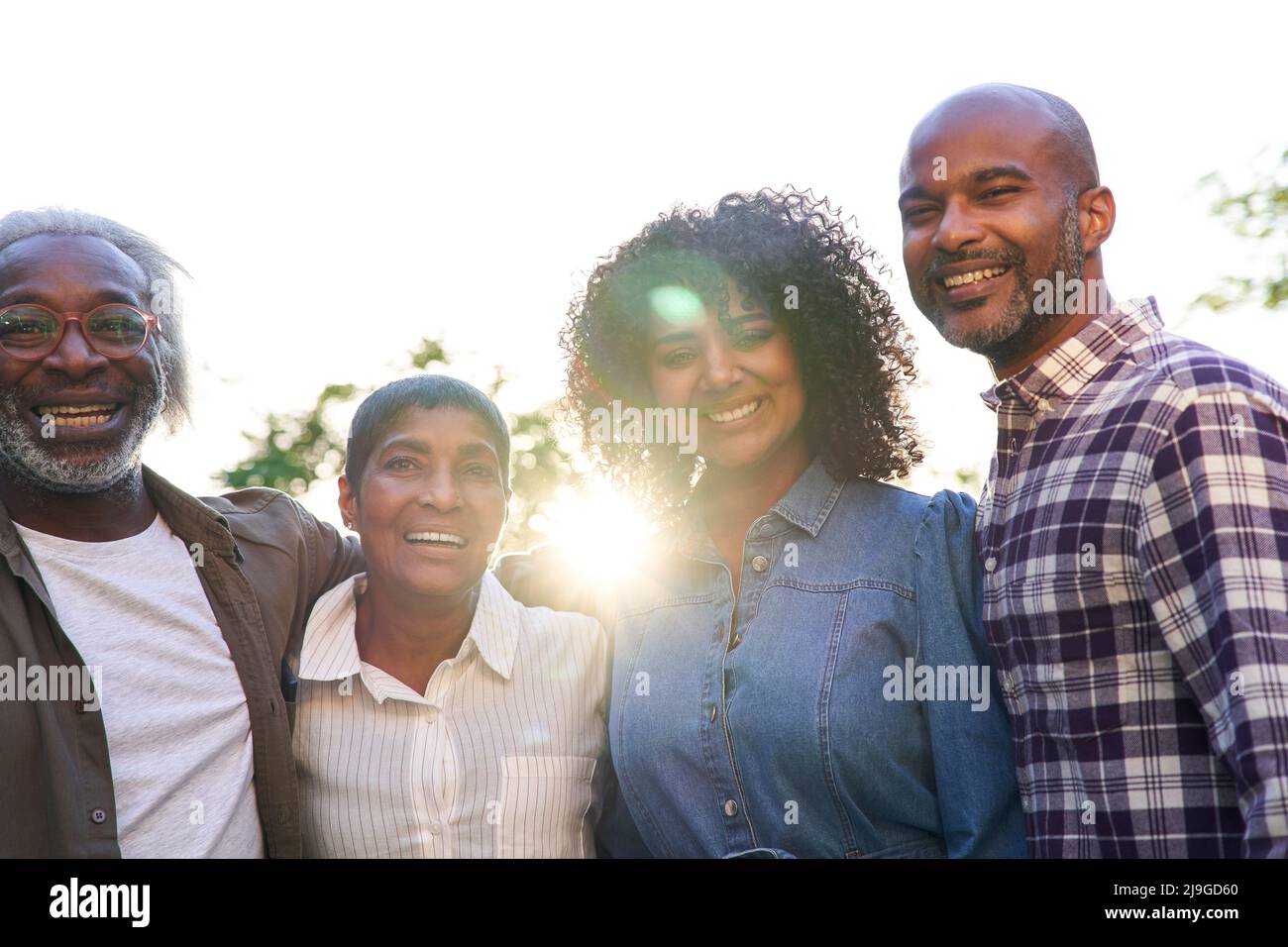 Happy multi-generation family standing in balcony Stock Photo - Alamy