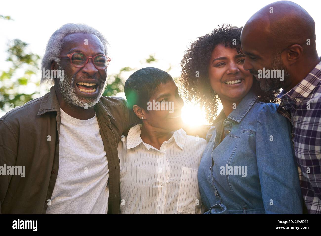 Happy multi-generation family standing in balcony Stock Photo - Alamy