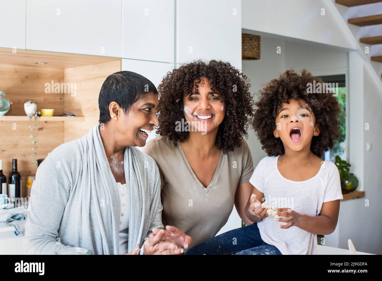 Multi-generation family preparing cookies Stock Photo - Alamy