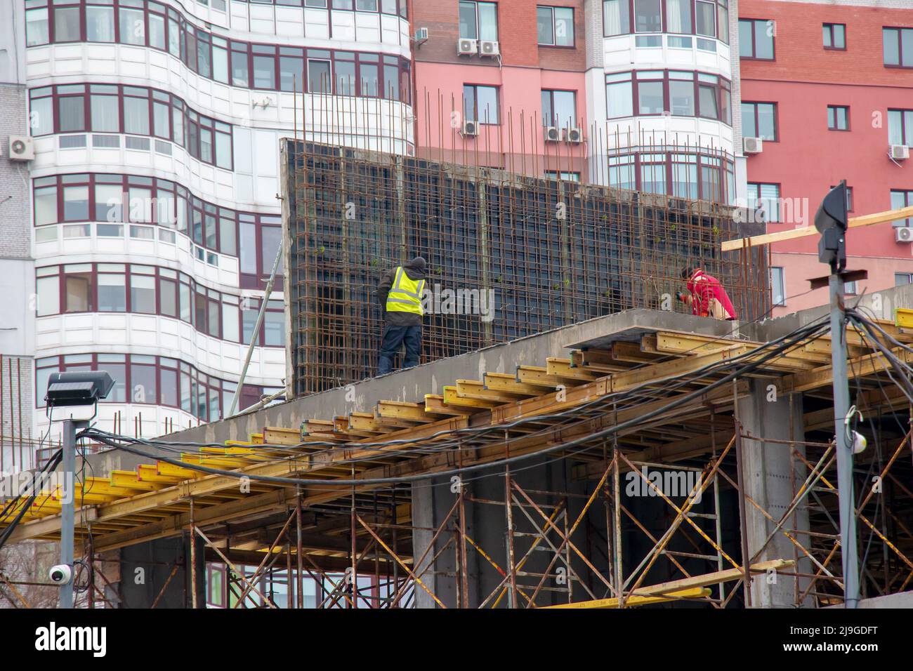 Construction site. The worker performs work at height Stock Photo - Alamy