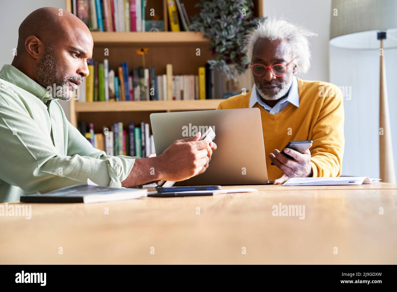 Father and son using technologies Stock Photo - Alamy