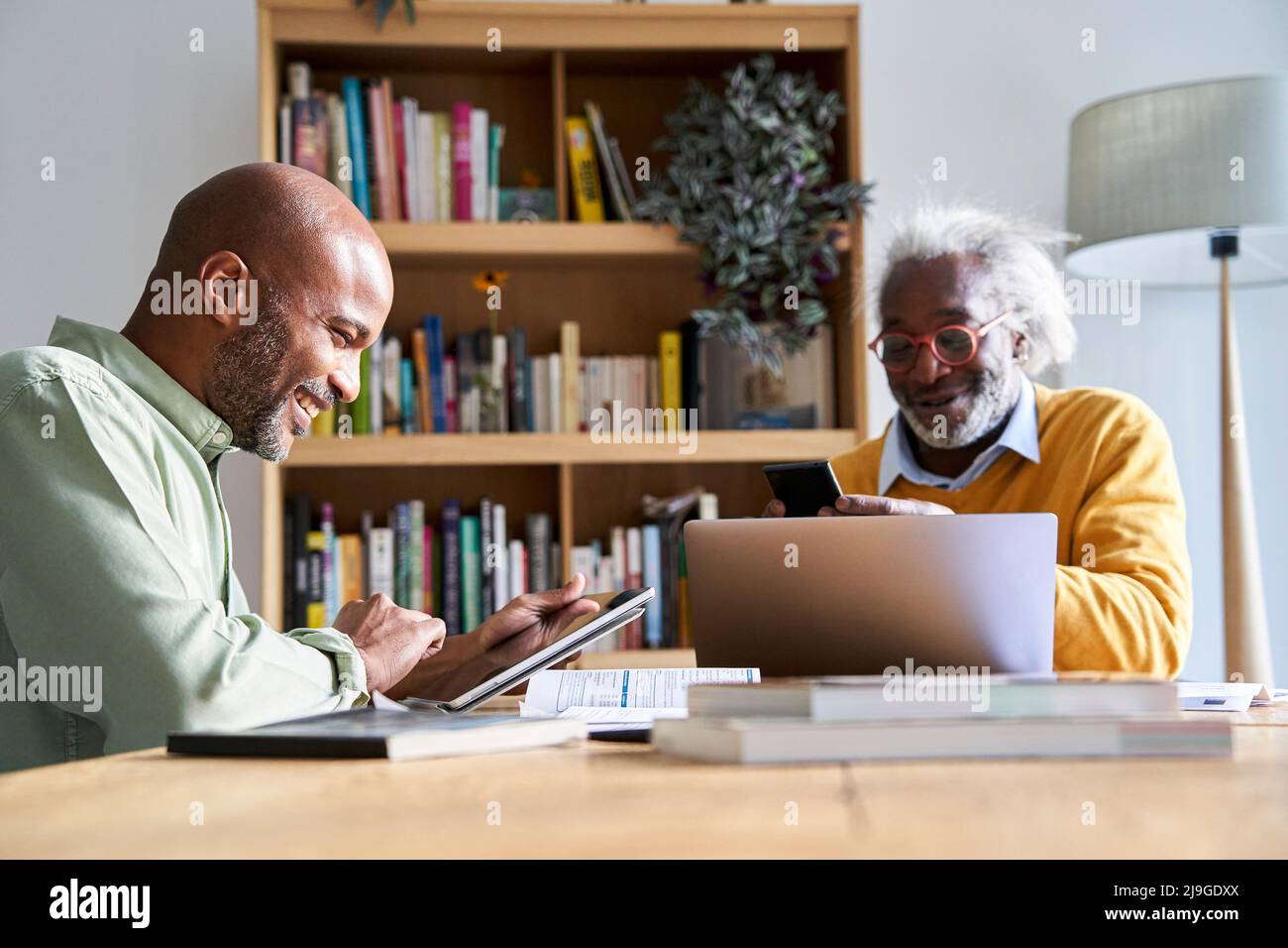 Father and son using technologies Stock Photo - Alamy