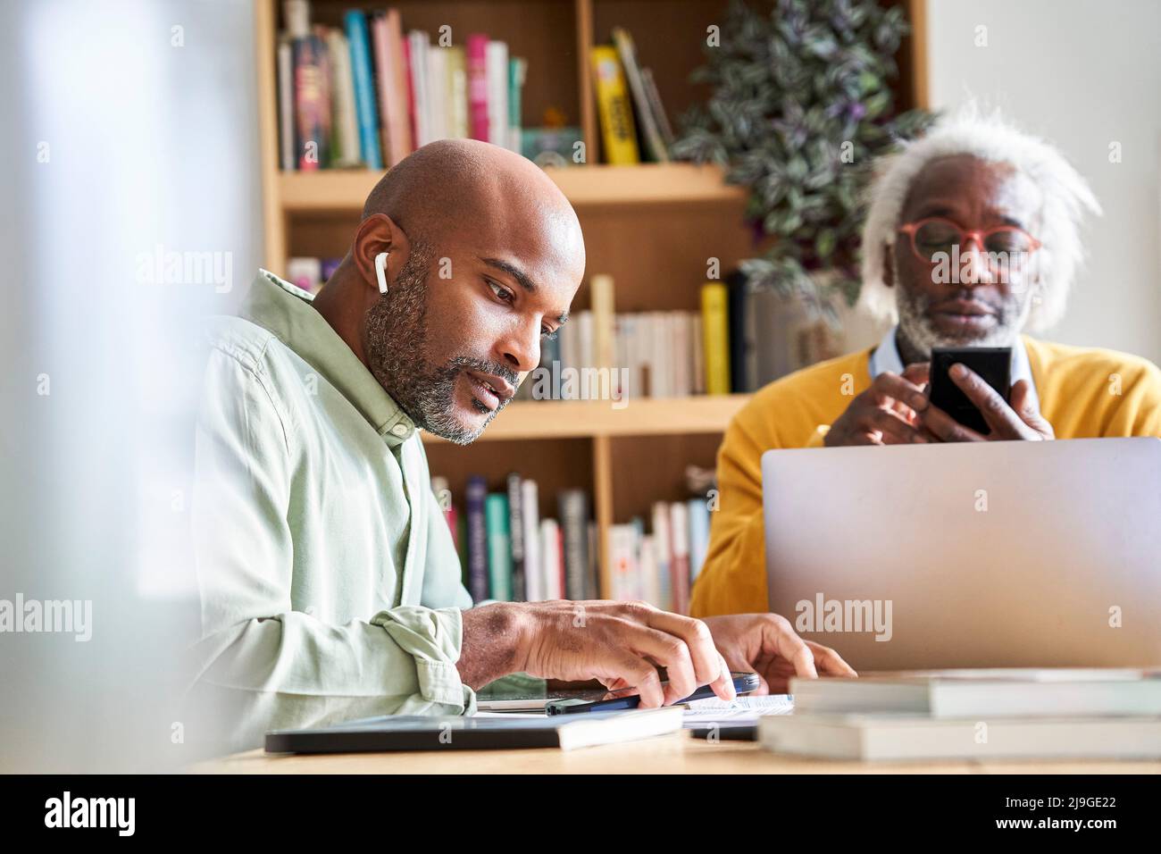 Father and son using technologies at home Stock Photo - Alamy