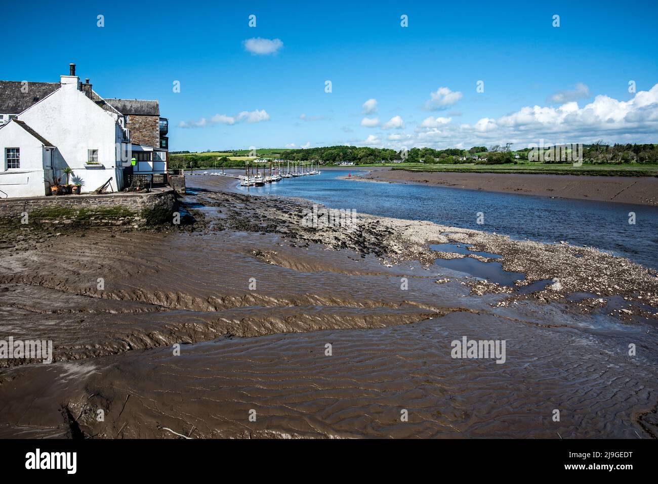 Exposed mud in tidal area on the River Dee at Kirkcudbright. alongside ...