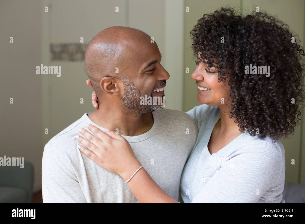 Smiling couple looking at each other Stock Photo - Alamy