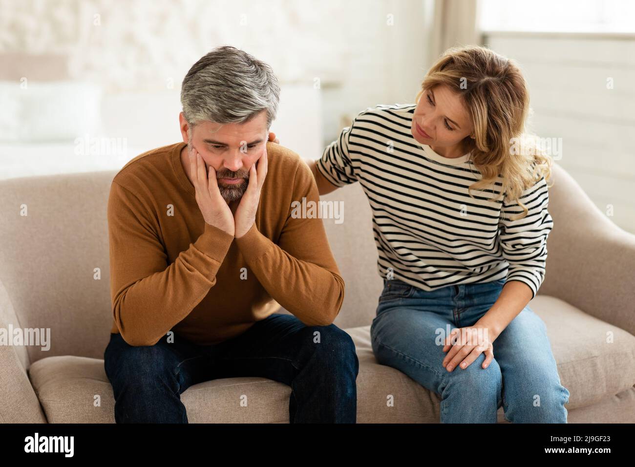 Middle Aged Wife Comforting And Supporting Depressed Husband At Home ...