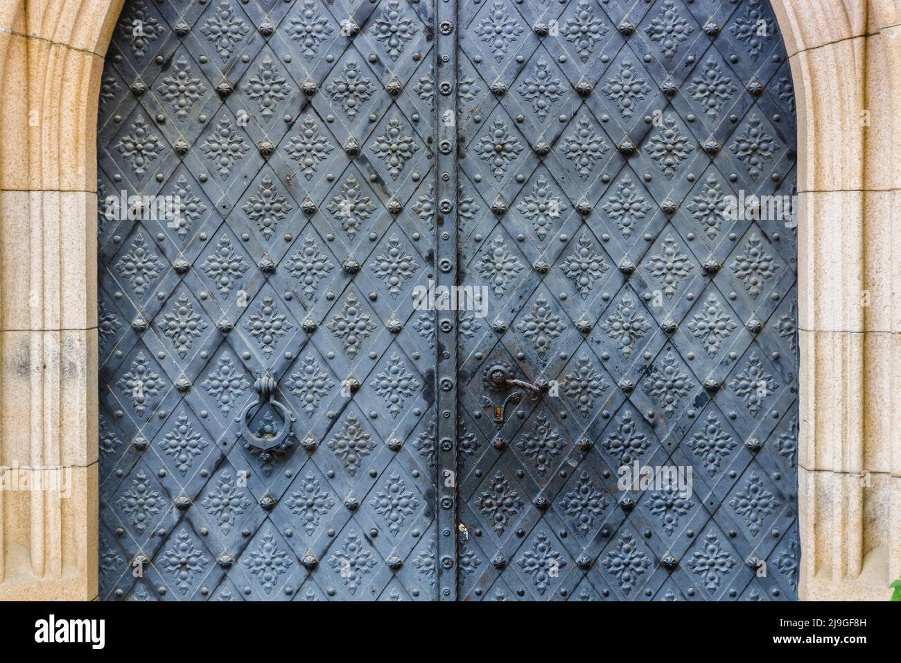 Old iron door to the entrance of the medieval castle Stock Photo - Alamy