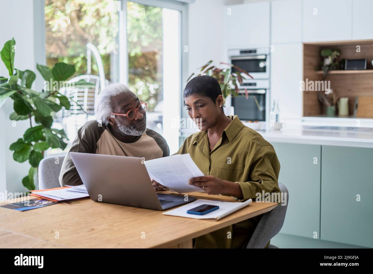 Couple looking on documents woman hi-res stock photography and images ...