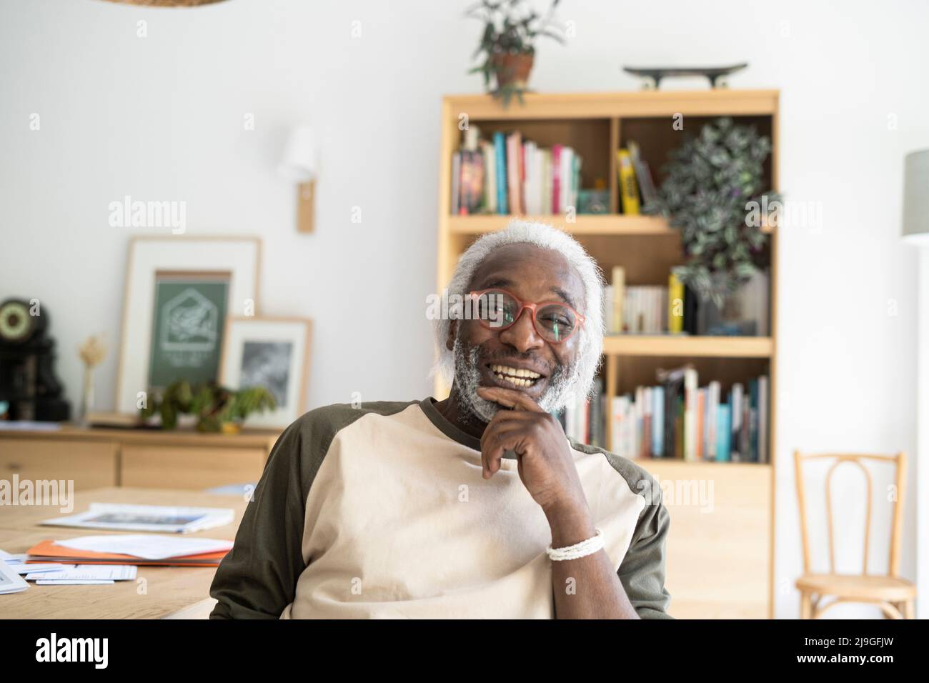 Senior man sitting on chairs hi-res stock photography and images - Alamy