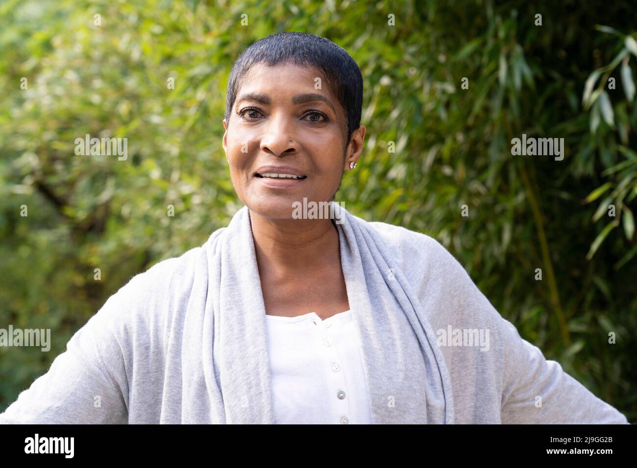Close-up of mature woman looking at camera Stock Photo - Alamy