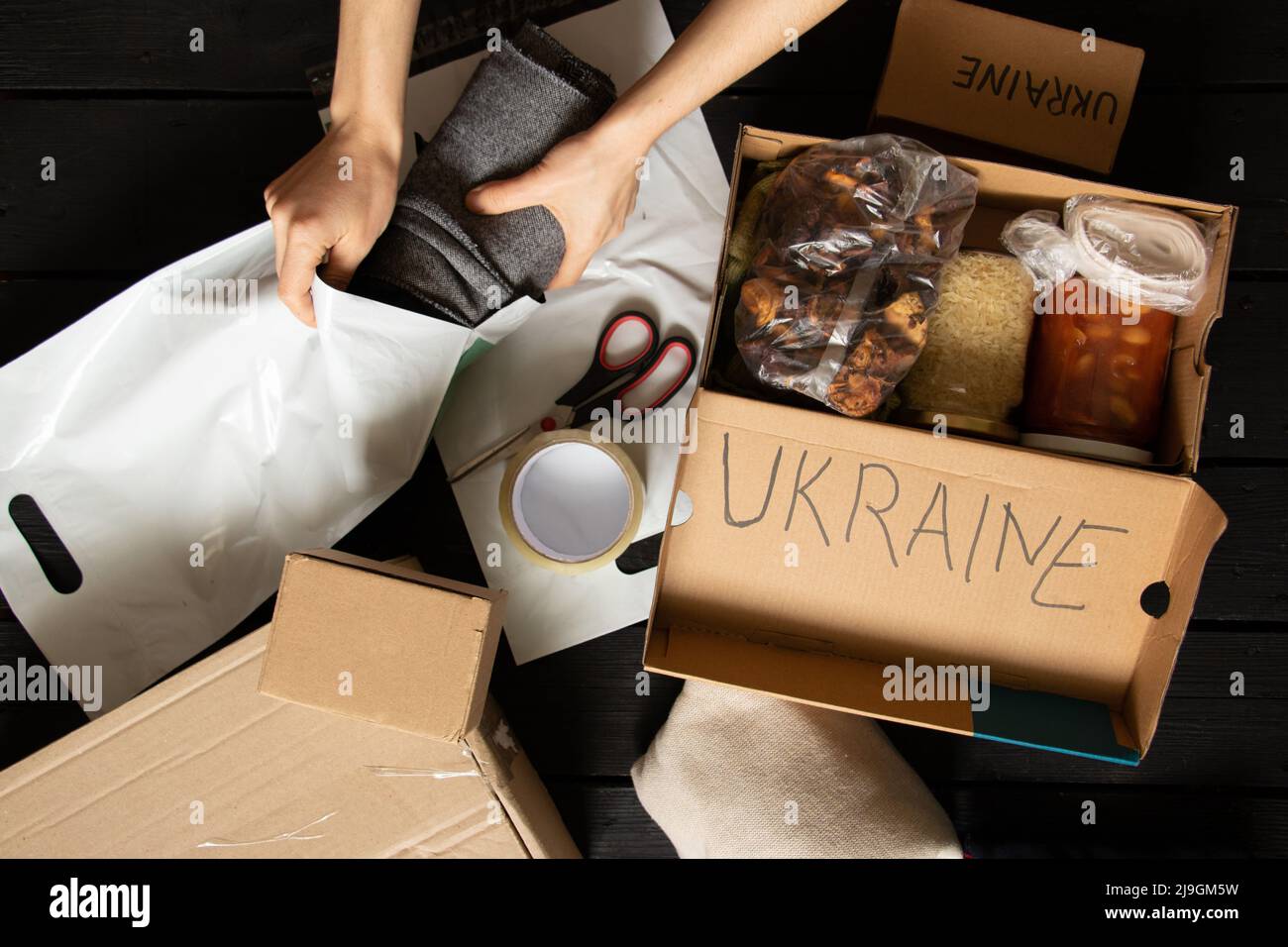 Collecting a humanitarian food set to help people who suffered during ...