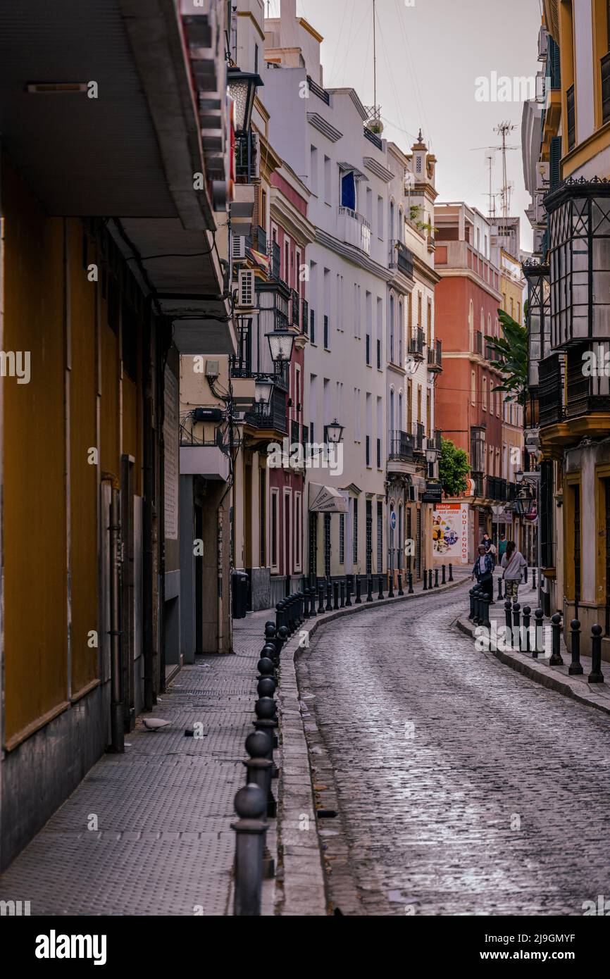 Seville, Spain-- May 15, 2022. A vertical shot looking down a curvy ...