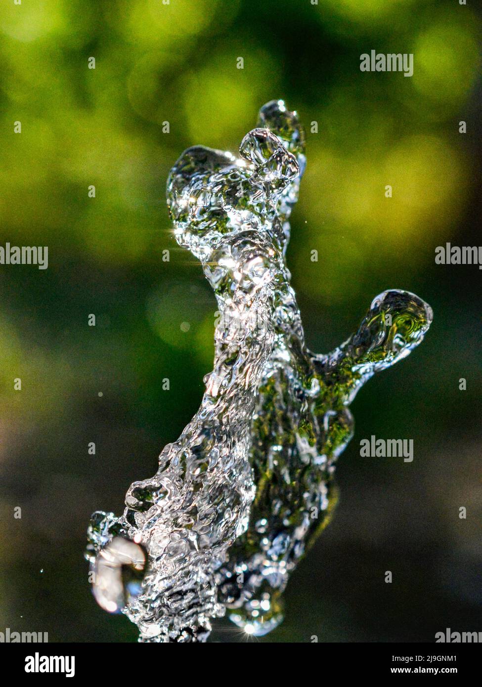 Waterdrops levitate on dark background. Water splash in dark with a ...