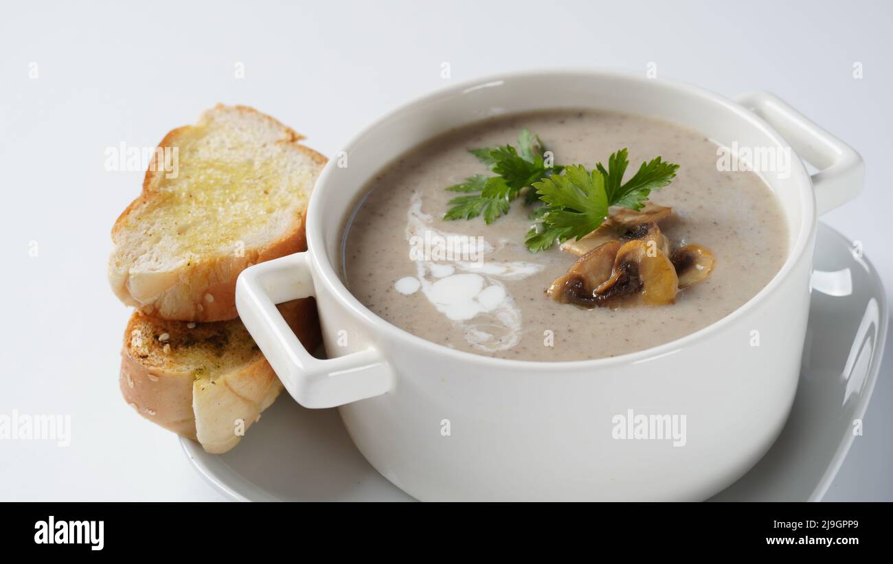 Mushroom Cream Soup with fried champignons and fresh parsley. Winter ...
