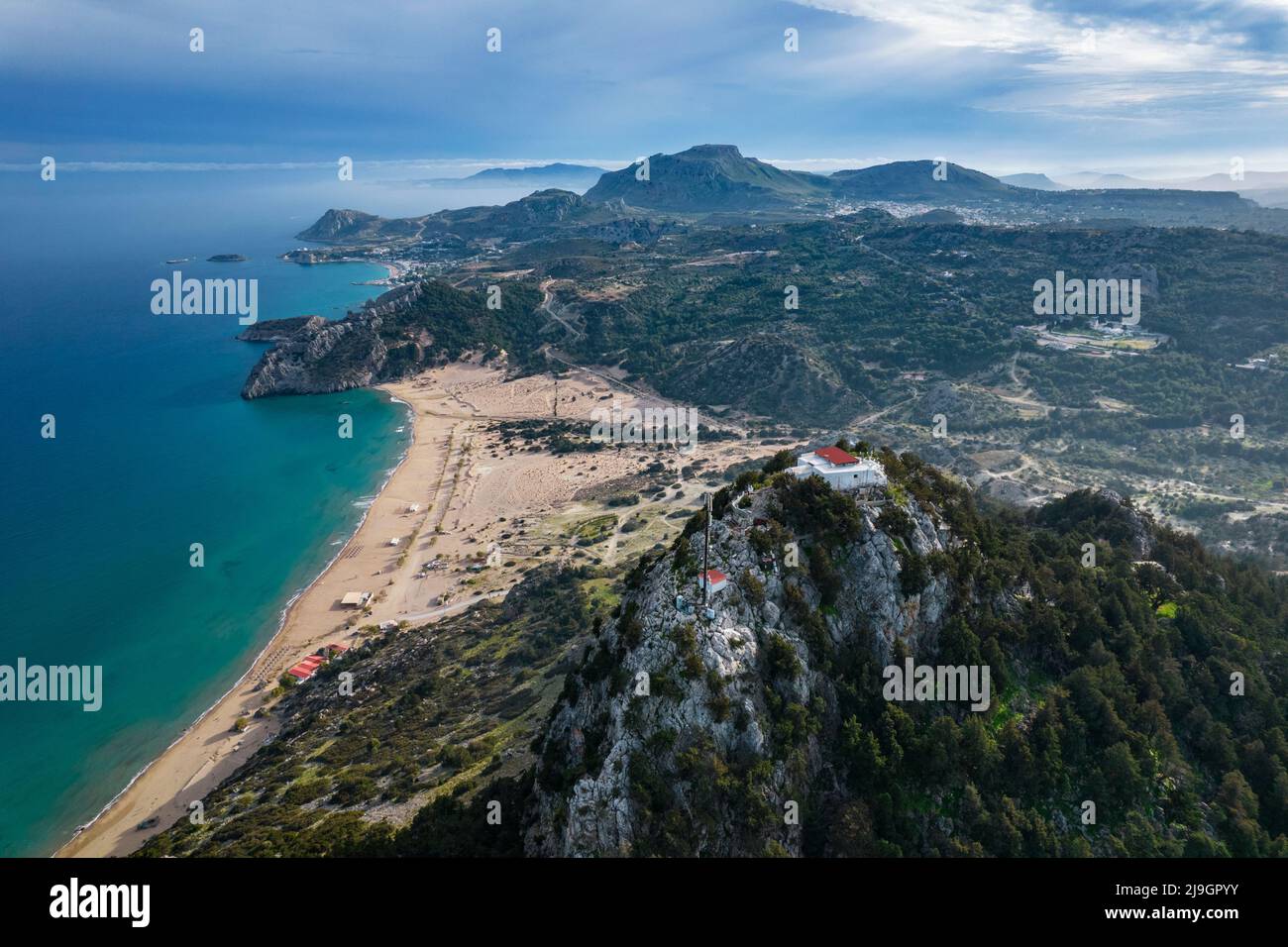 Orthodox cliff chapel above Greek beach Stock Photo - Alamy