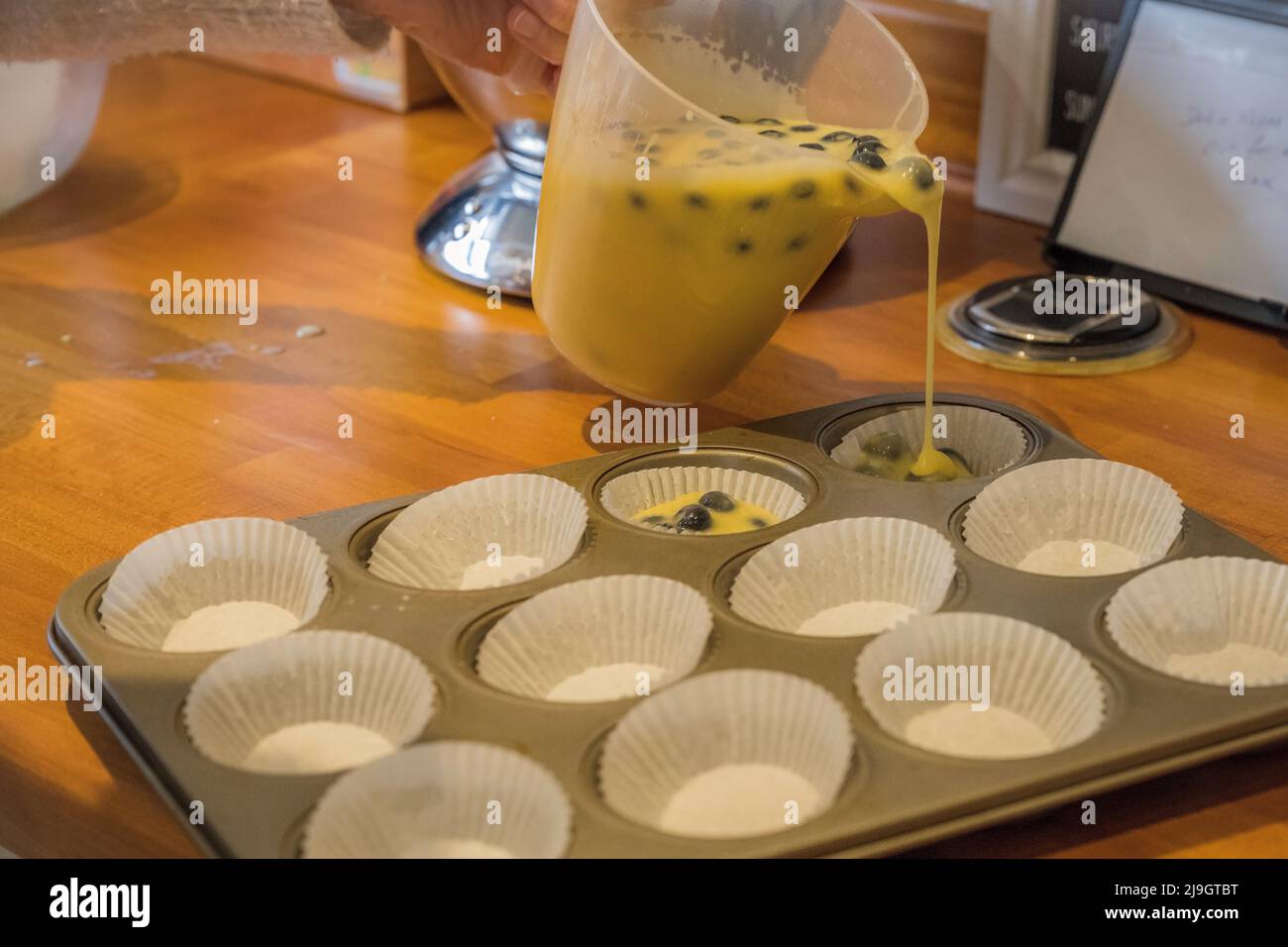 Pouring into the baking tray Stock Photo - Alamy