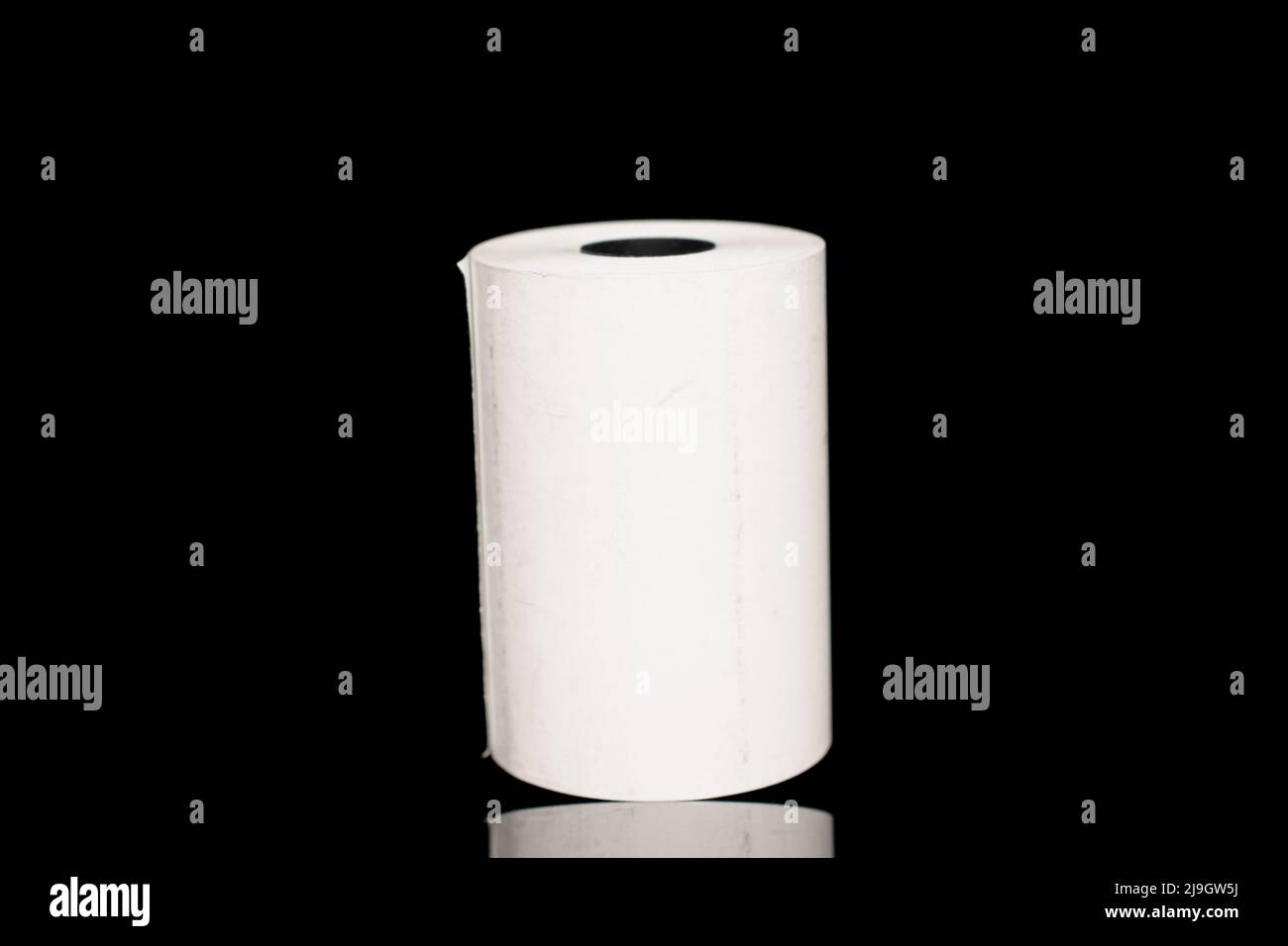 One roll of paper cash tape, close-up isolated on black Stock Photo - Alamy