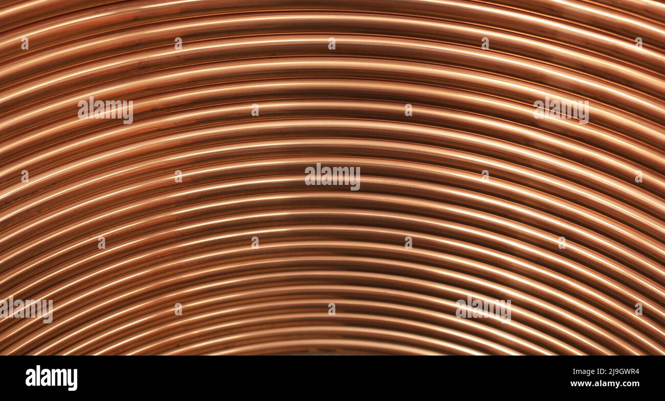 Copper pipes, industry business production background Stock Photo - Alamy