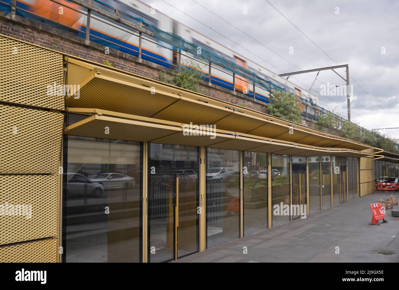 Small business redeveloped under railway arches by train and overground ...