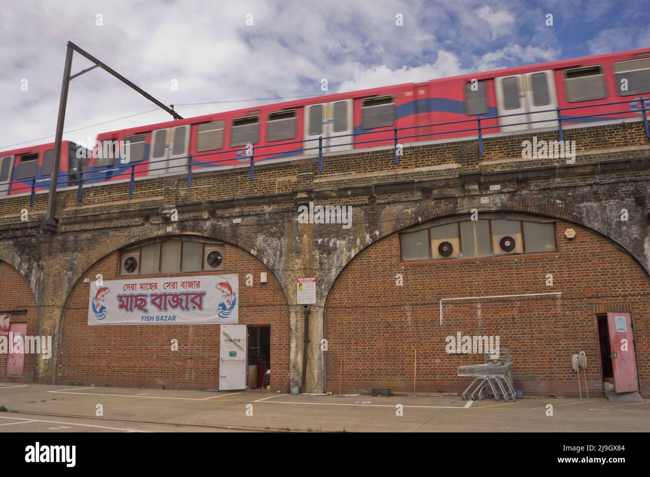 Small business redeveloped under railway arches by train and overground ...