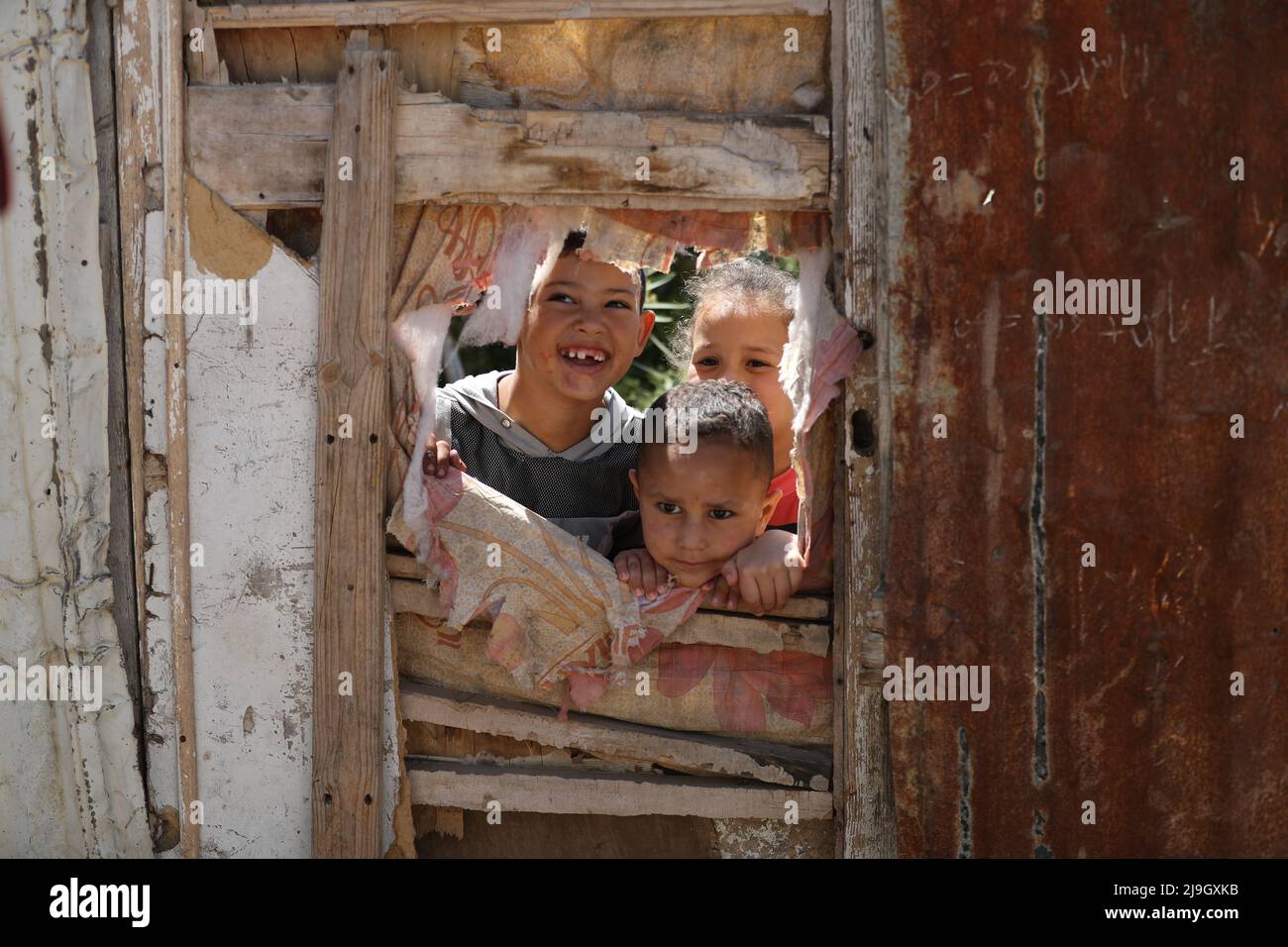 Palestinian children play near their house in a slum in Beit Hanoun in ...