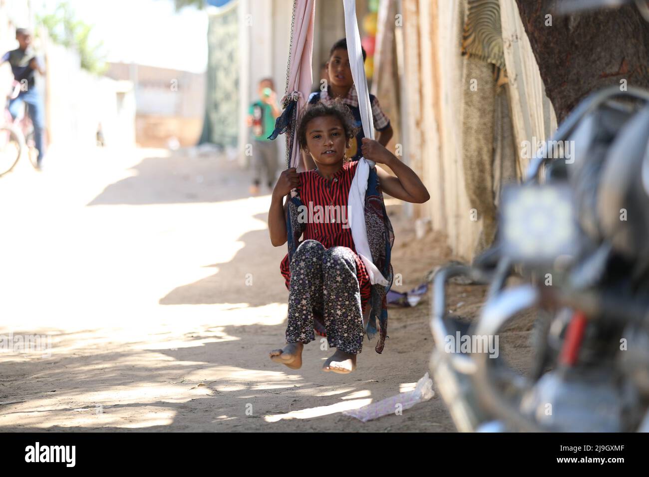 Palestinian children play near their house in a slum in Beit Hanoun in ...