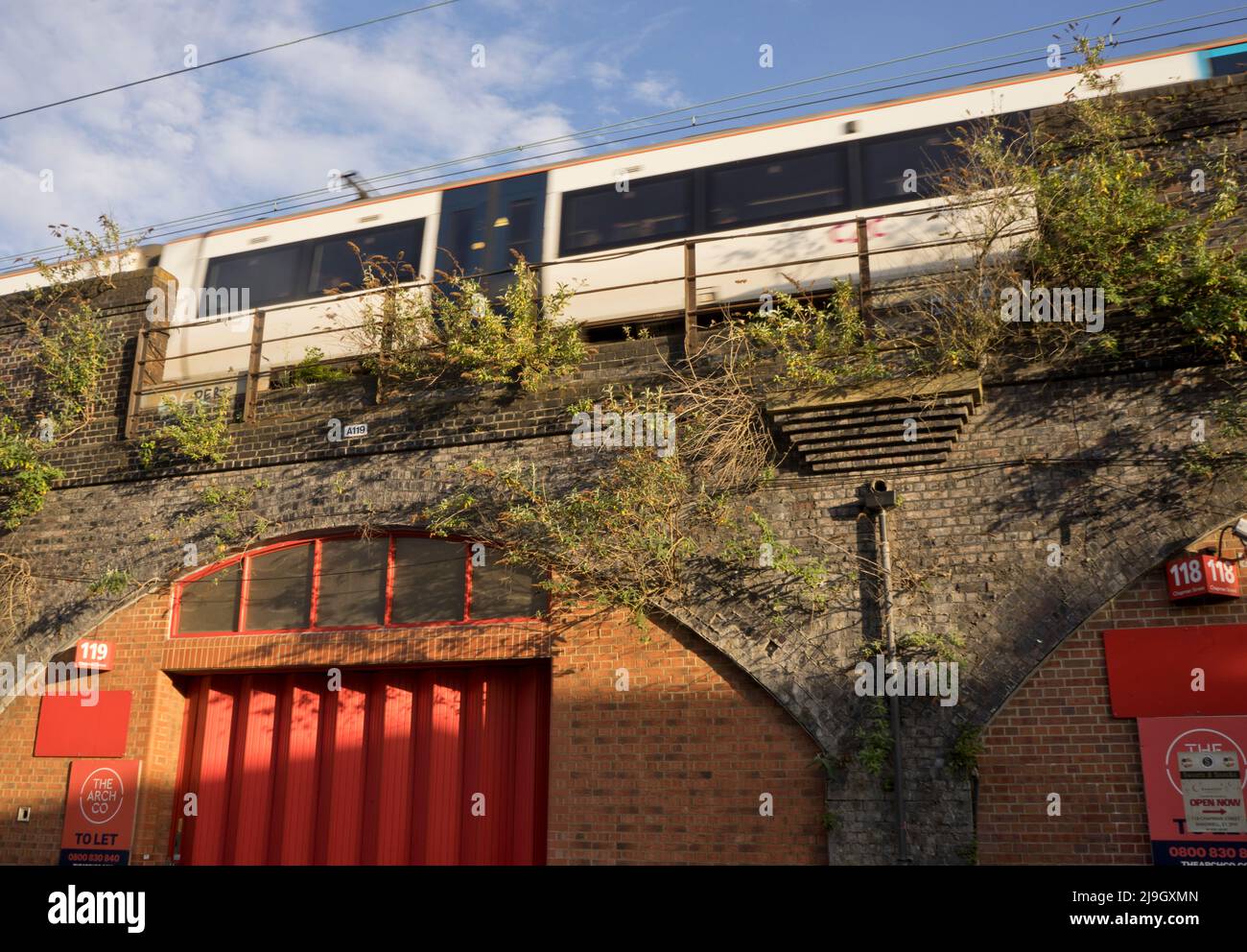 Small business redeveloped under railway arches by train and overground ...