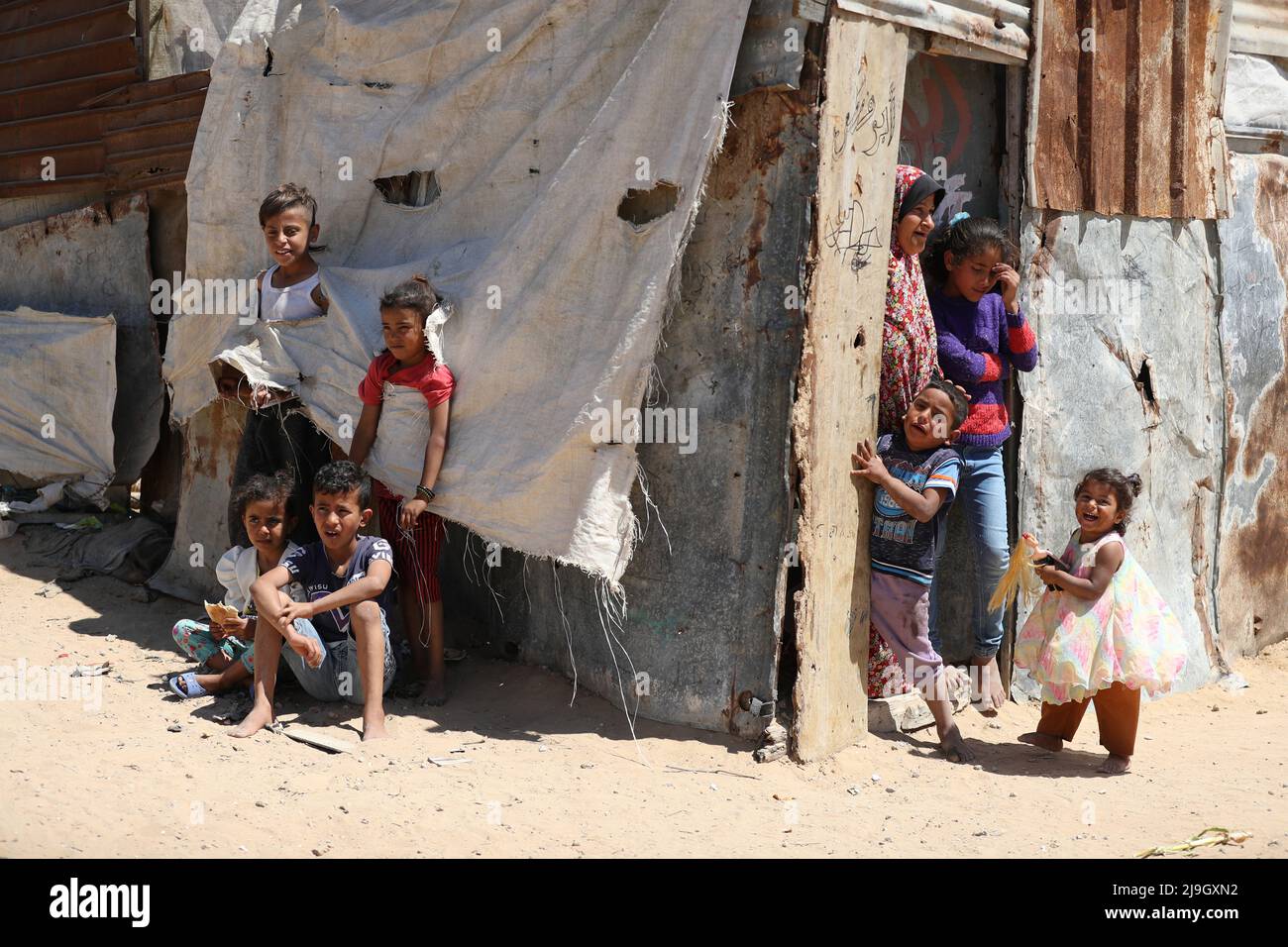 Palestinian children play near their house in a slum in Beit Hanoun in ...