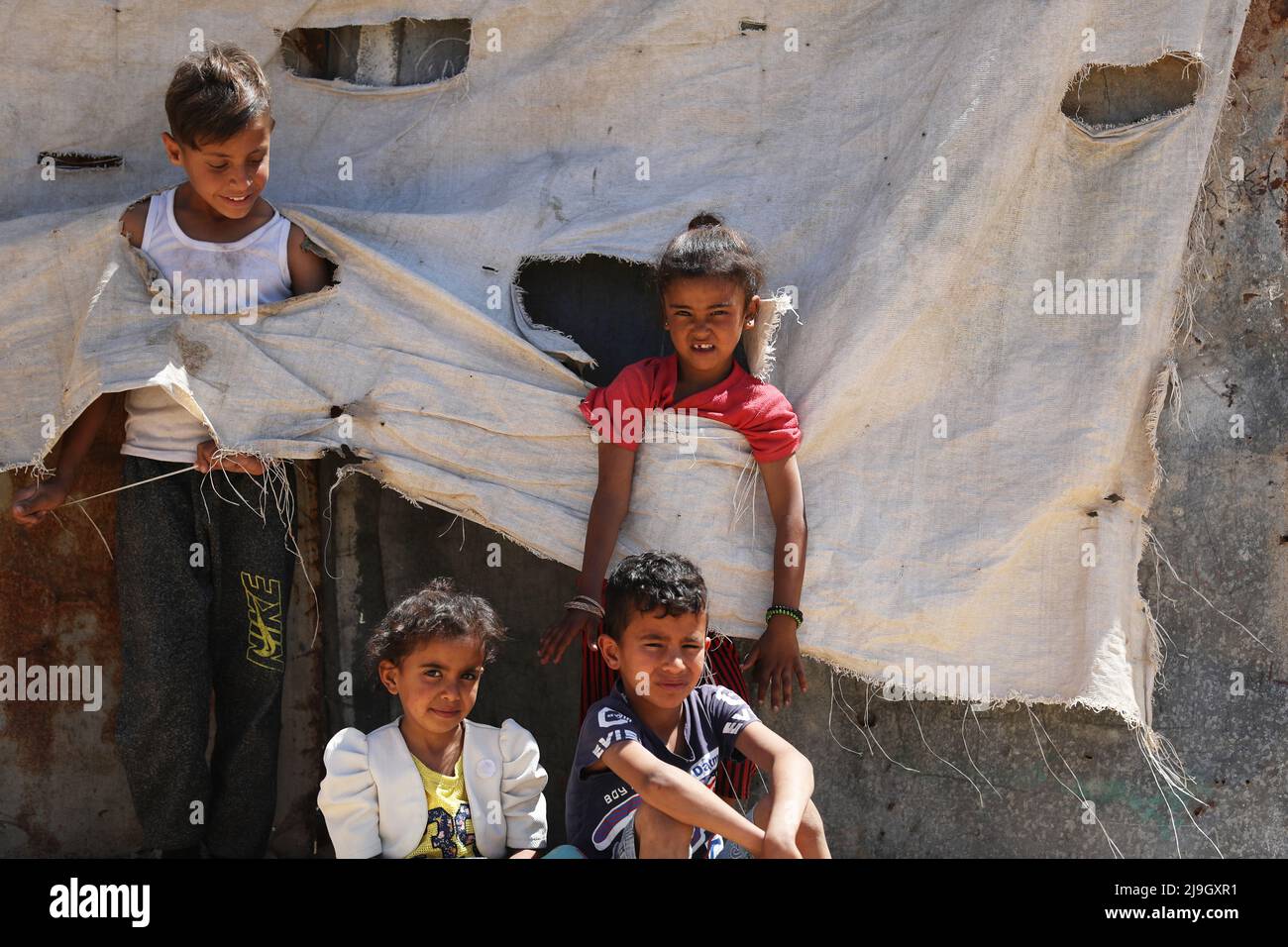Palestinian children play near their house in a slum in Beit Hanoun in ...