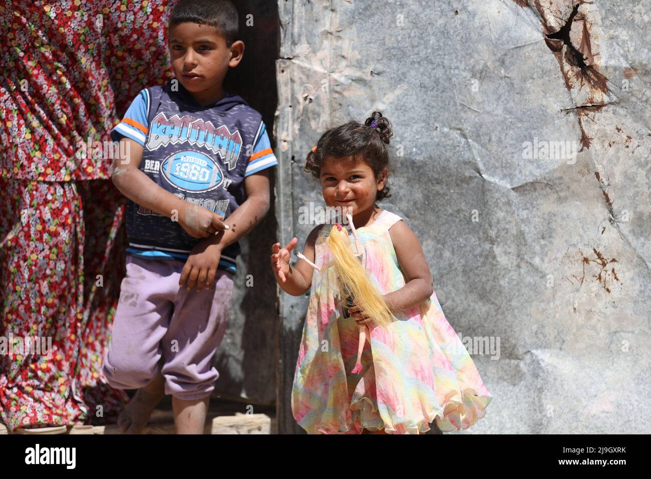 Palestinian children play near their house in a slum in Beit Hanoun in ...