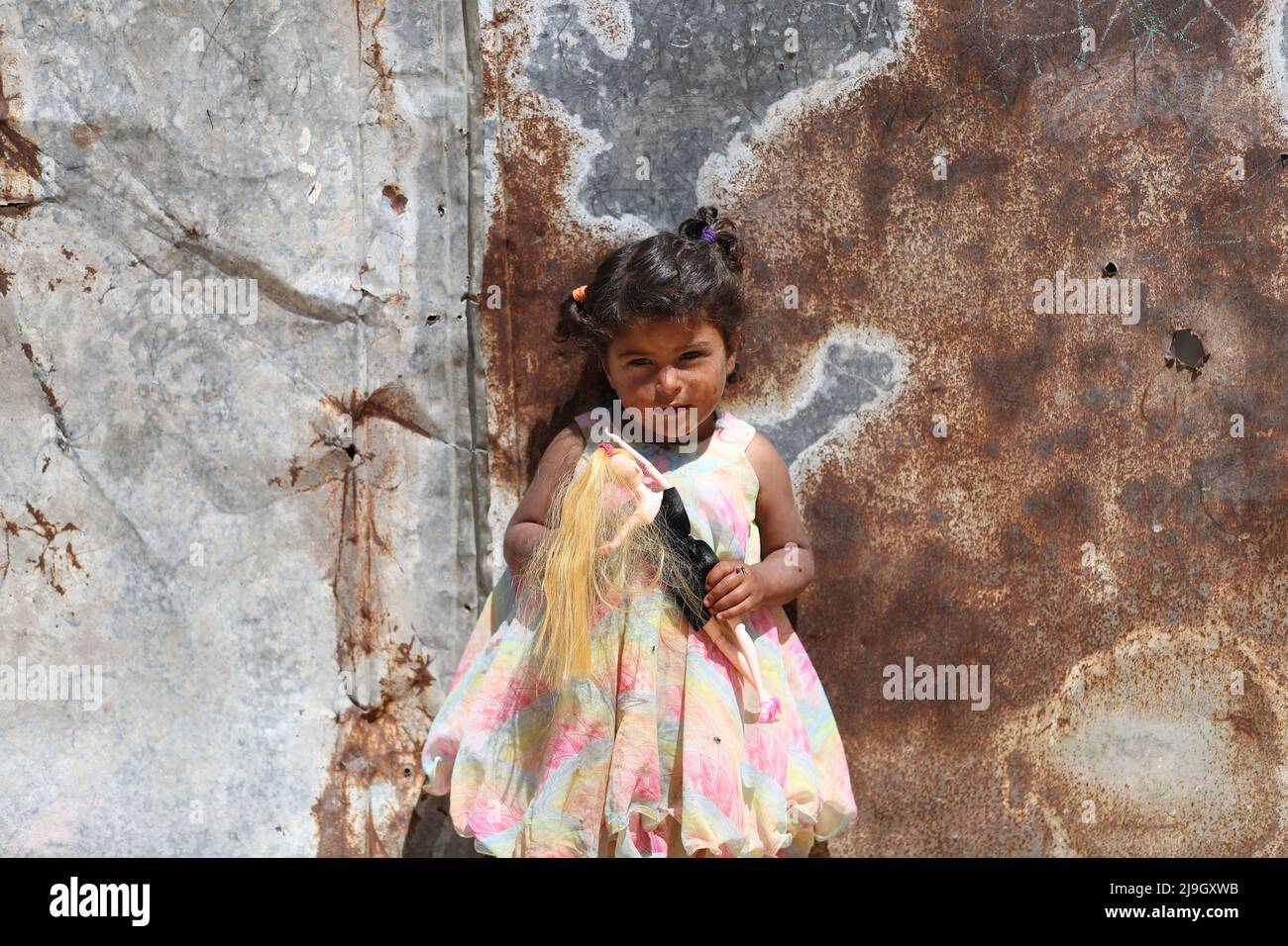 Palestinian children play near their house in a slum in Beit Hanoun in ...