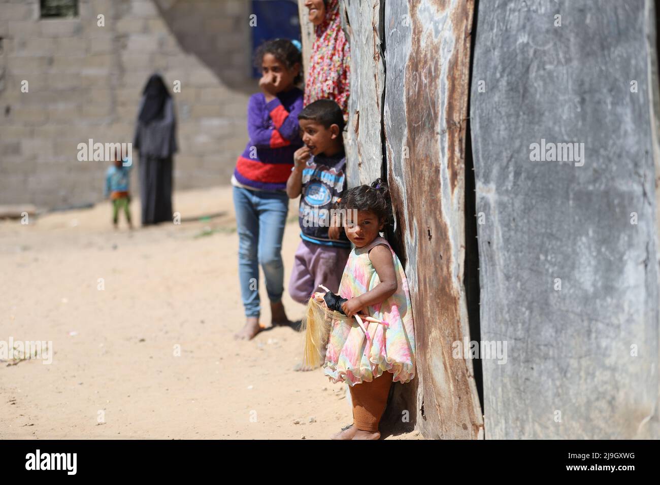 Palestinian children play near their house in a slum in Beit Hanoun in ...