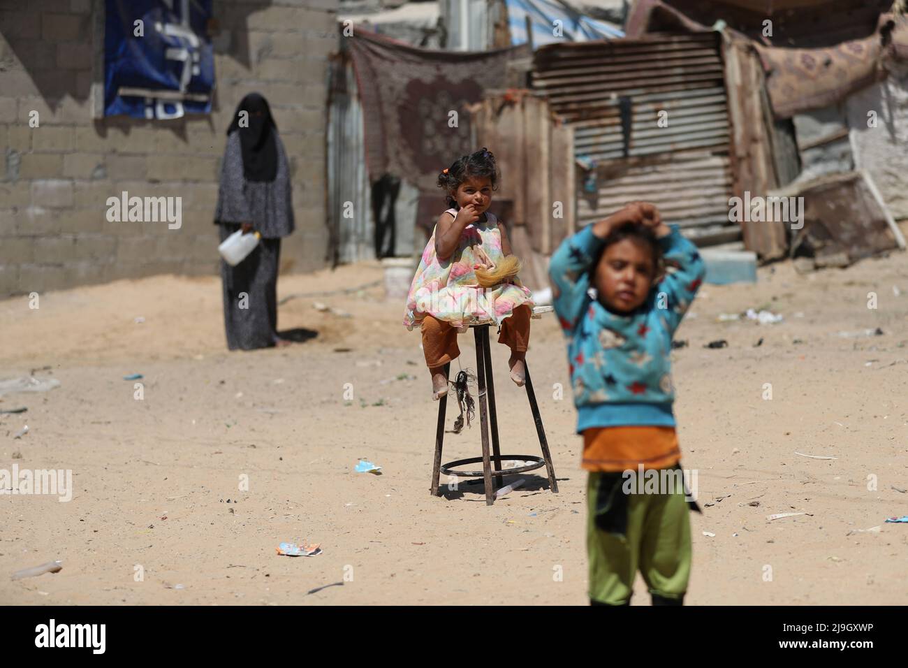 Palestinian children play near their house in a slum in Beit Hanoun in ...