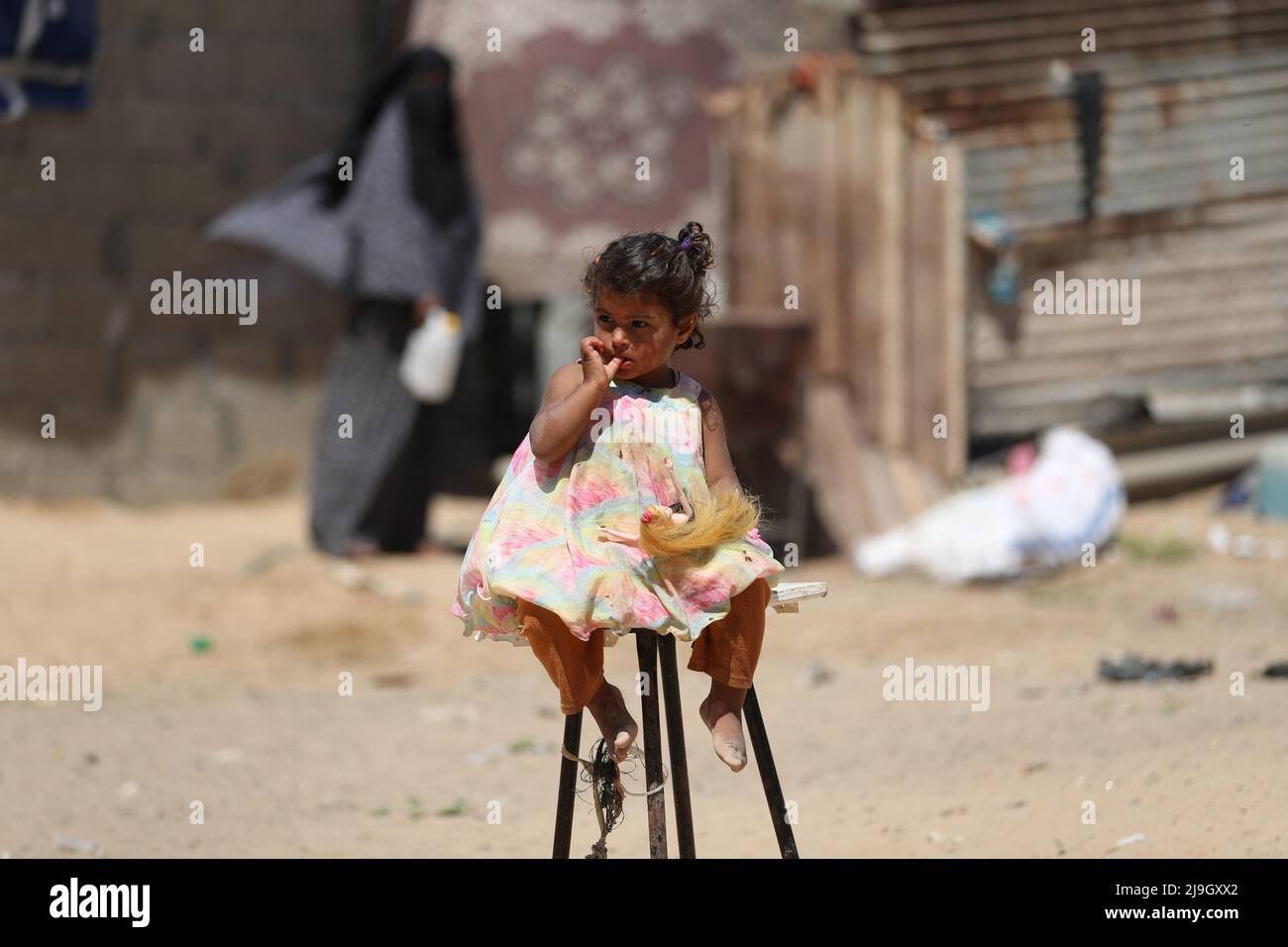 Palestinian children play near their house in a slum in Beit Hanoun in ...