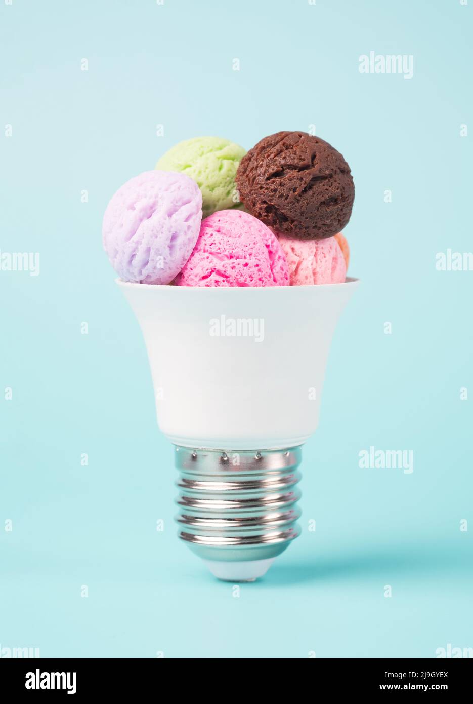 Light bulb base with ice cream balls. Energy deficit conceptual ...