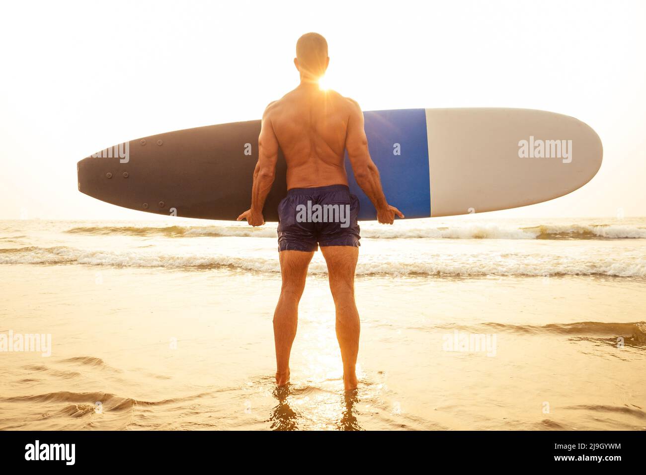 surfing freelancing man muscle and press sport training on the beach at ...