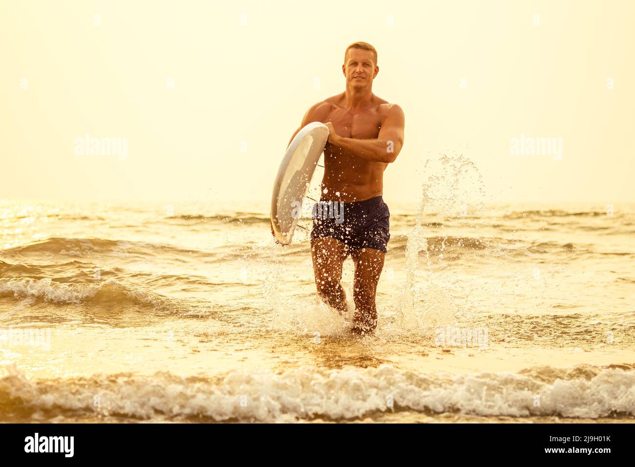 Silhouette man surfing in sea active hi-res stock photography and ...