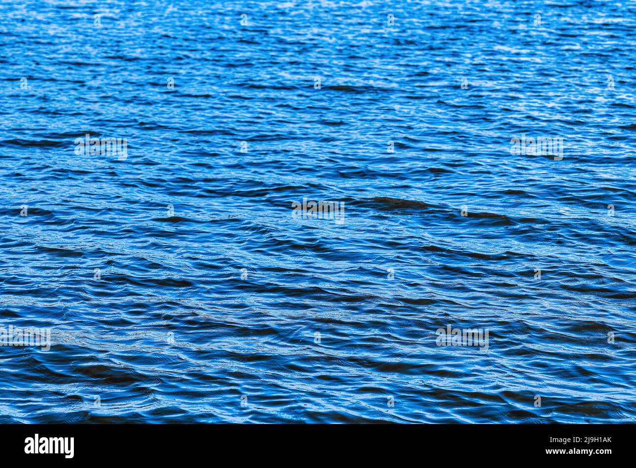 The texture of the ripples on the blue water in the sea or lake Stock ...