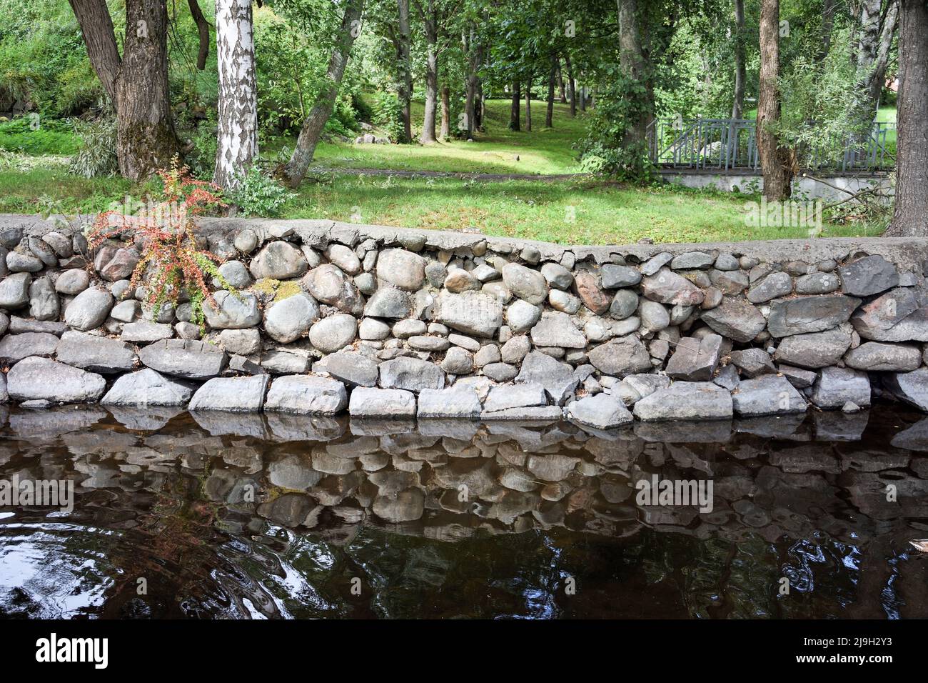 Small water canal at summer season Stock Photo - Alamy