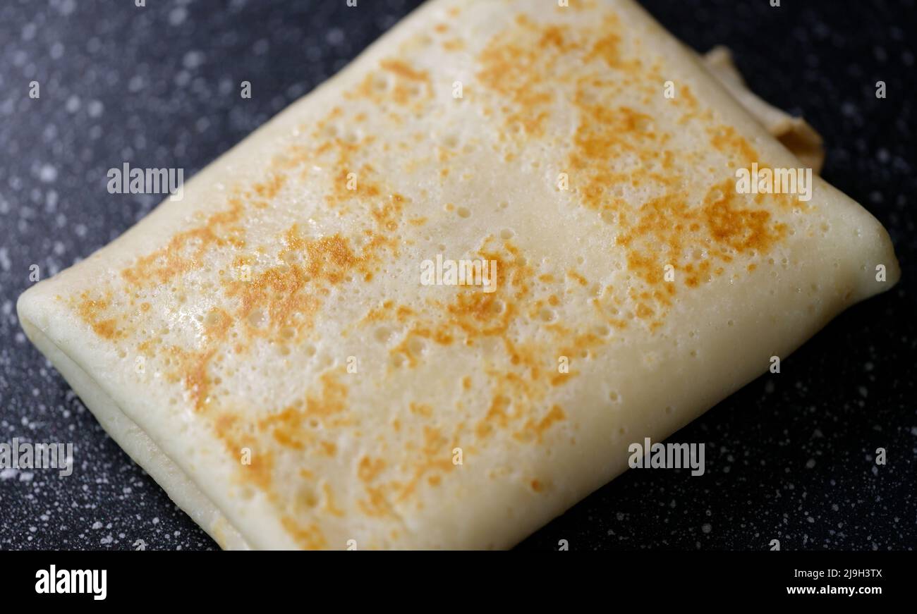 Thin pancake in frying hi-res stock photography and images - Alamy
