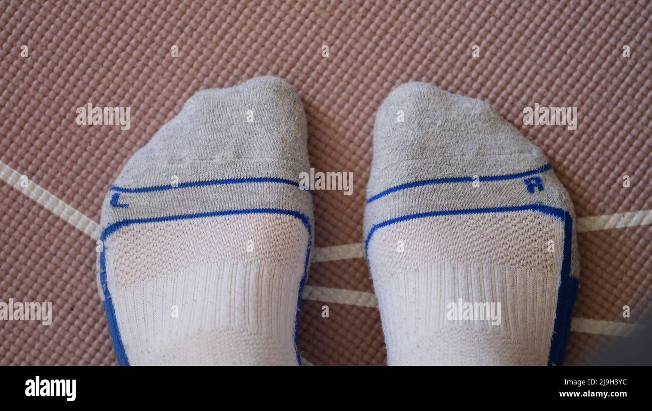Feet in socks hi-res stock photography and images - Alamy