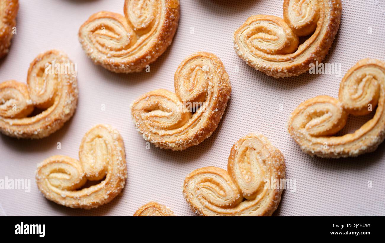Delicious appetizing pretzels with sugar puff pastry background Stock ...