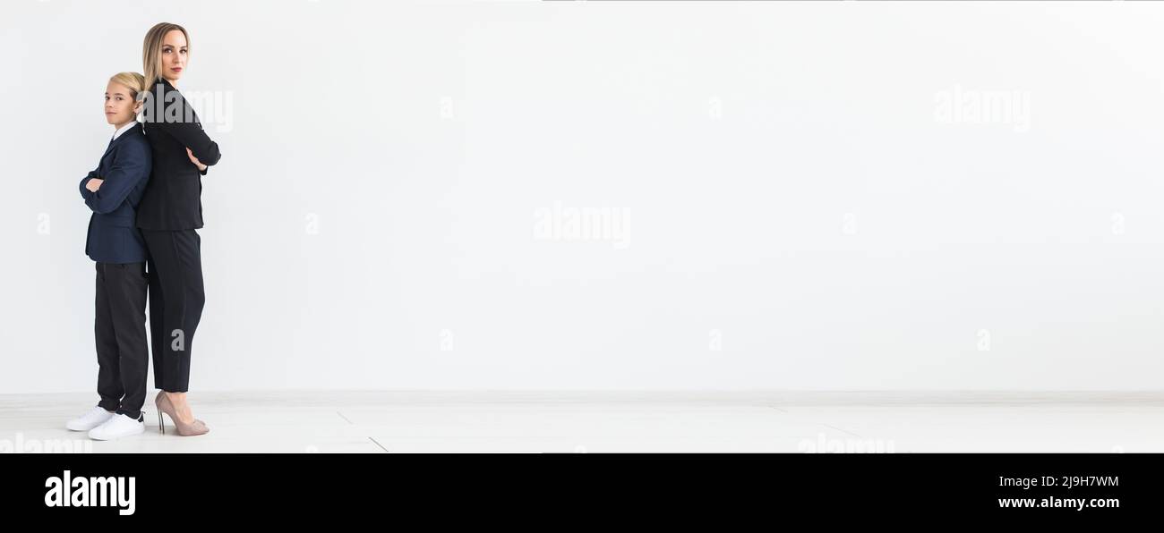 Teenager and single parent - Young mother and son standing together ...