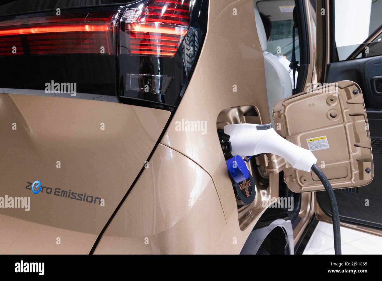 Yokohama, Japan. 23rd May, 2022. EV charging plug of the new Nissan ...